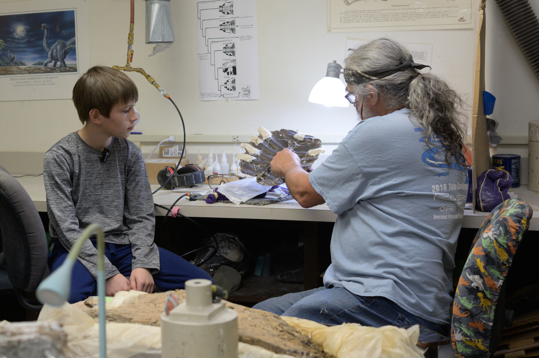Nevada boy works on turtle fossil discovered in Lander