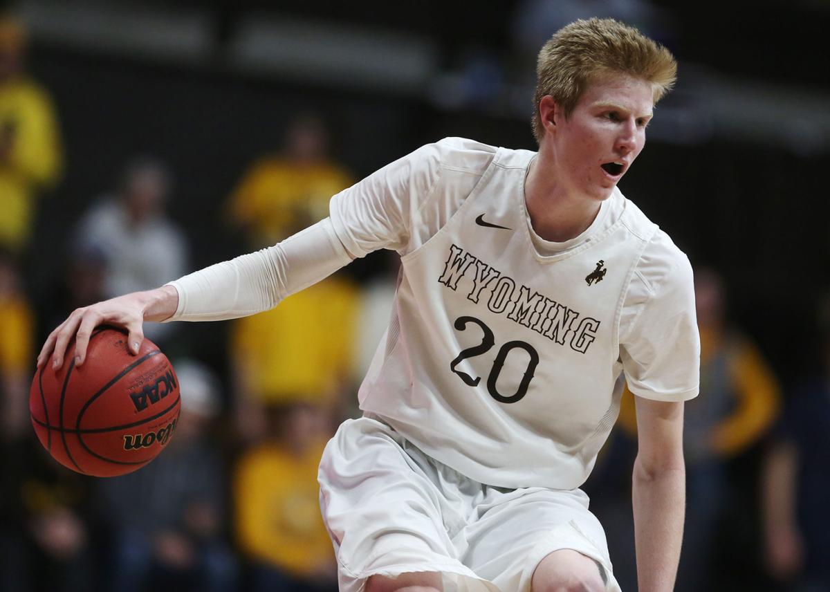 Wyoming men's basketball holds on for road win at Utah State | Men's ...