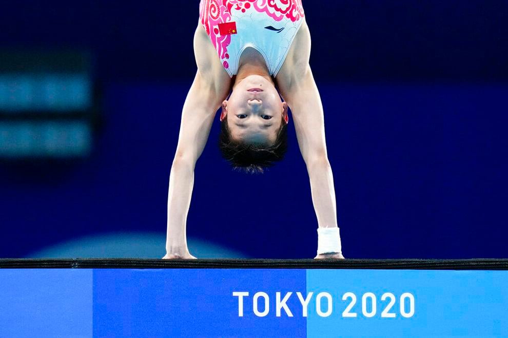 Snapshots of 14-year-old Chinese diver's perfect run at gold