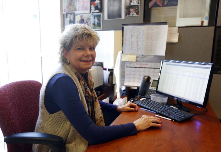Breast cancer survivor works front desk of cancer imaging business
