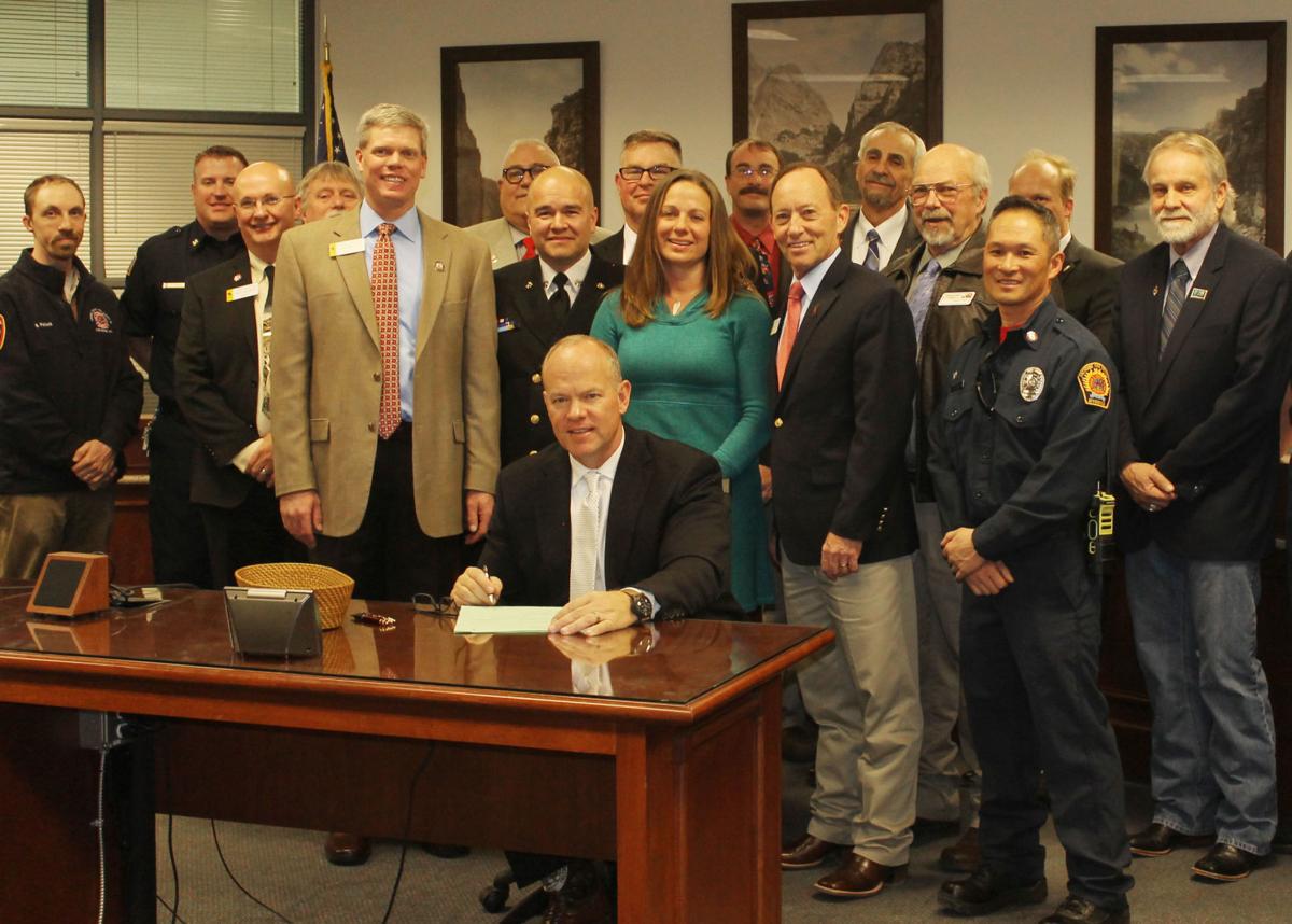 Firefighters celebrate passing of law ensuring access to benefits