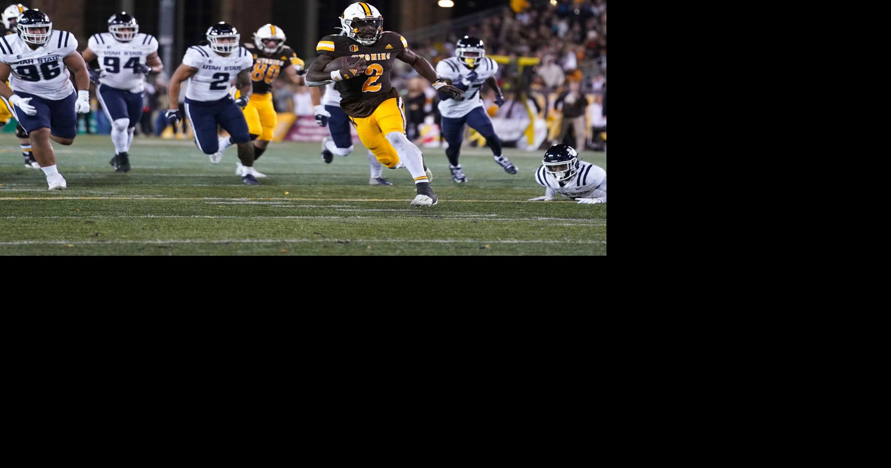 Titus Swen, Wyoming Cowboys run over Utah State Aggies for homecoming ...