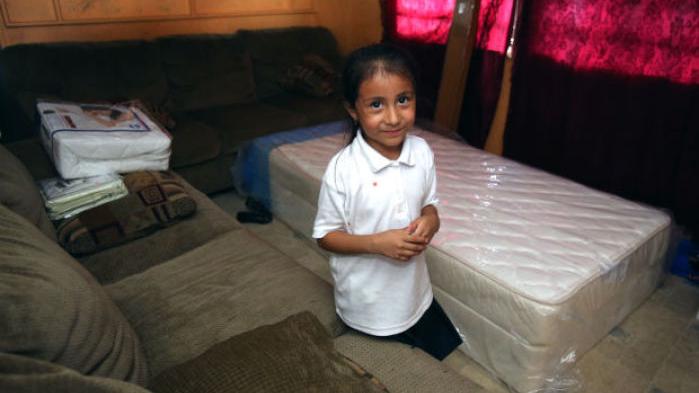 Photos: Sam Levitz delivers beds to those in need