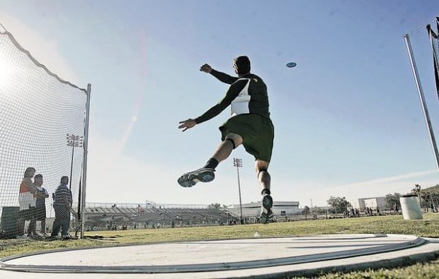 CDO standout flexing his muscles in shot put, discus