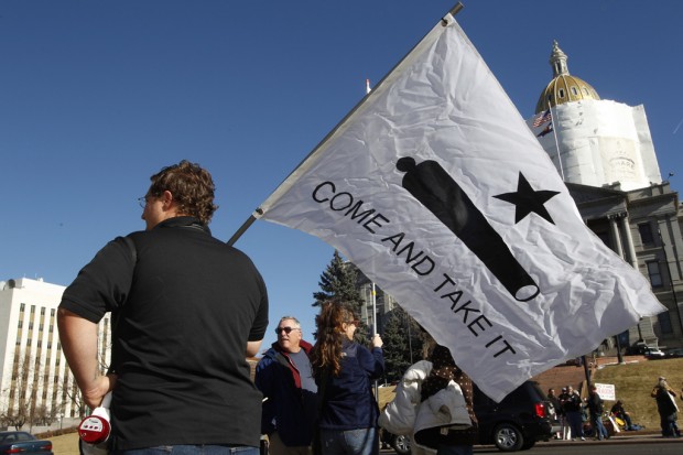 2 Ariz. gun dealers challenge rifle-reporting rule