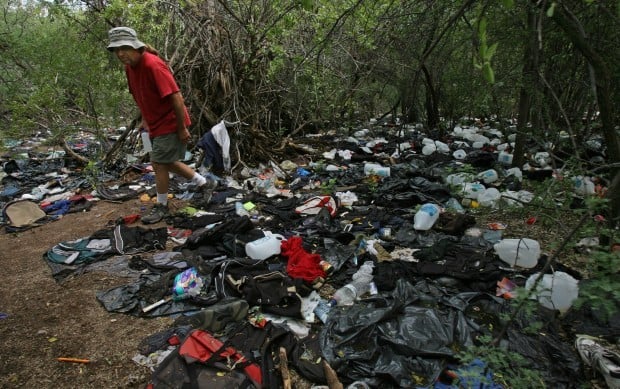 Crossers burying border in garbage