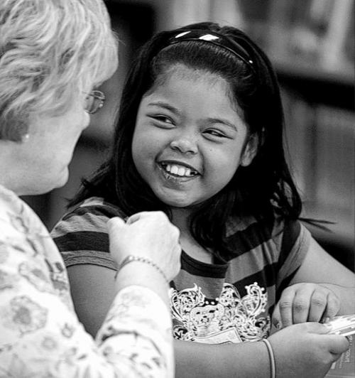 Volunteers, kids underline importance of reading skills