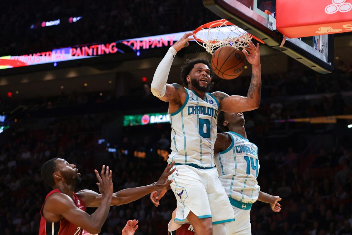 Charlotte Hornets forward Miles Bridges (0) dunks against Miami Heat ...
