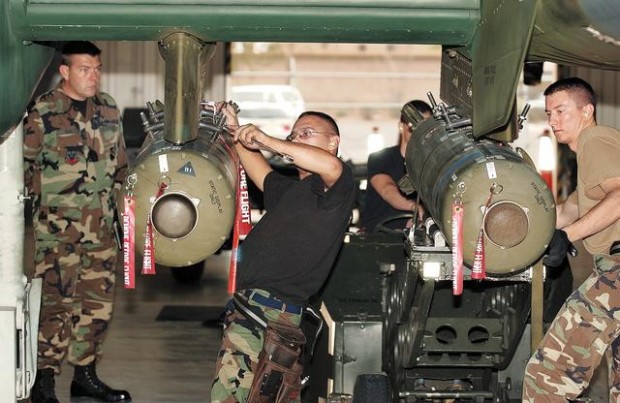 Photo package: Bomb loaders race the clock