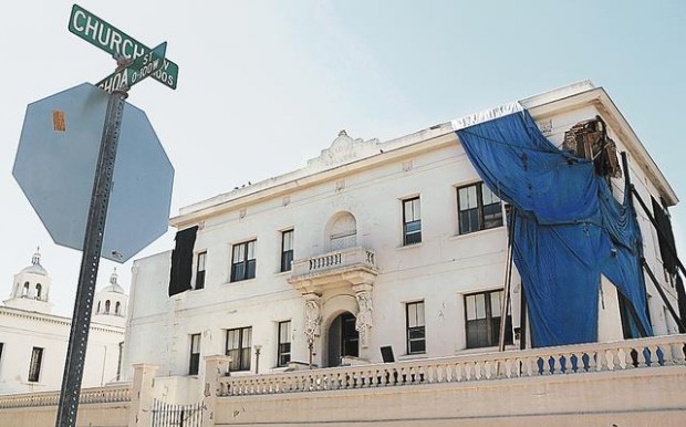 Tarp not enough to save 90-year-old building
