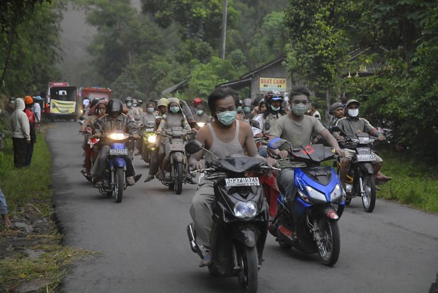 Indonesian villagers try to escape volcano's wrath