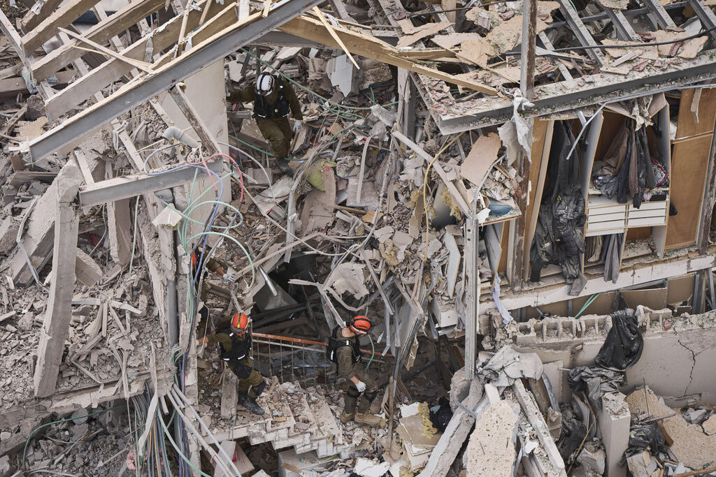 Photos show damage in Haifa and Tel Aviv after Iranian missile barrage