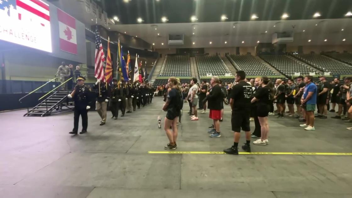 Crowds watch the introduction ceremony ahead of the Tucson Arena 9/11 ...