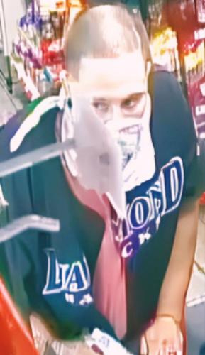 Armed man robs gas station, police seek help IDing