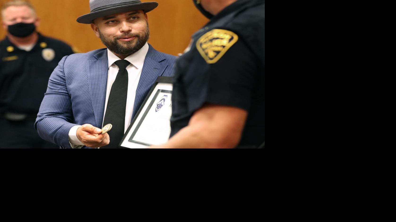 Tucson police honor man who saved toddler thrown into traffic lanes