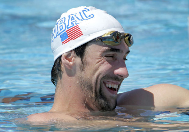 Legendary swimmer Phelps is happy to be back doing what he loves