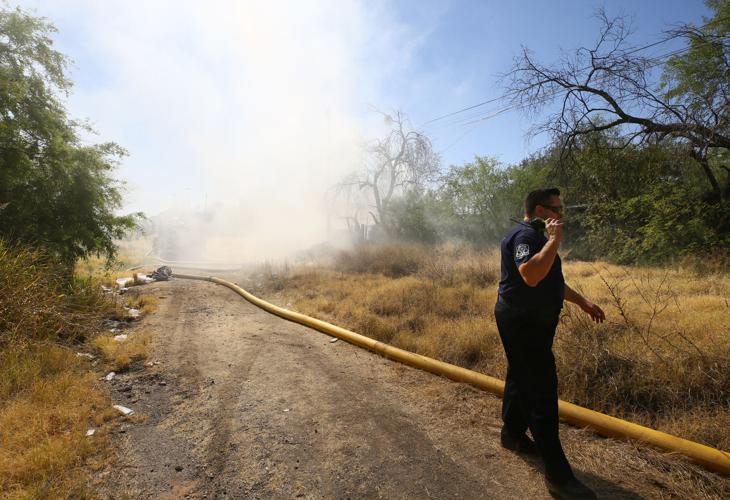 Debris and brush fire produces heavy smoke in South Tucson