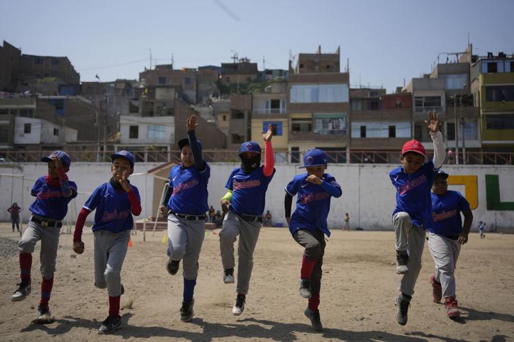 Baseball a shelter for Venezuelan kids in soccer-mad Peru