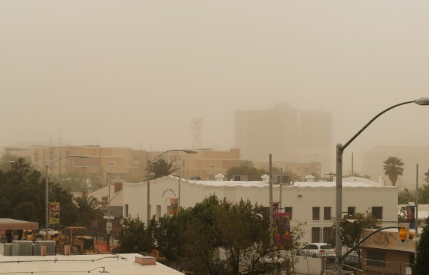 Photos: Dust storm rolls across Tucson