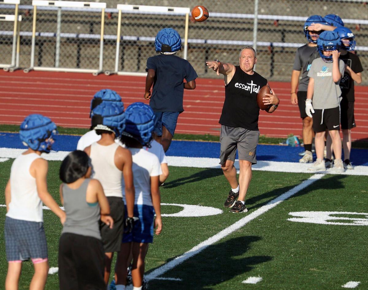 Praying high school football coach finally gets his job back