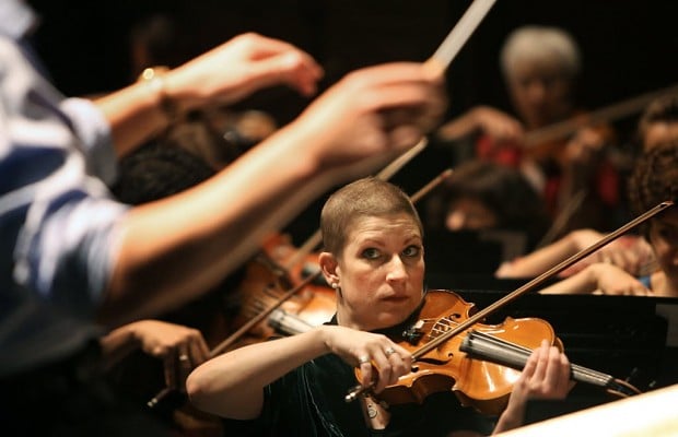 Violinist confronts cancer, never misses a beat