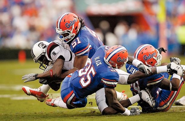 Gators drag Spurrier, S.C., through muck at Swamp