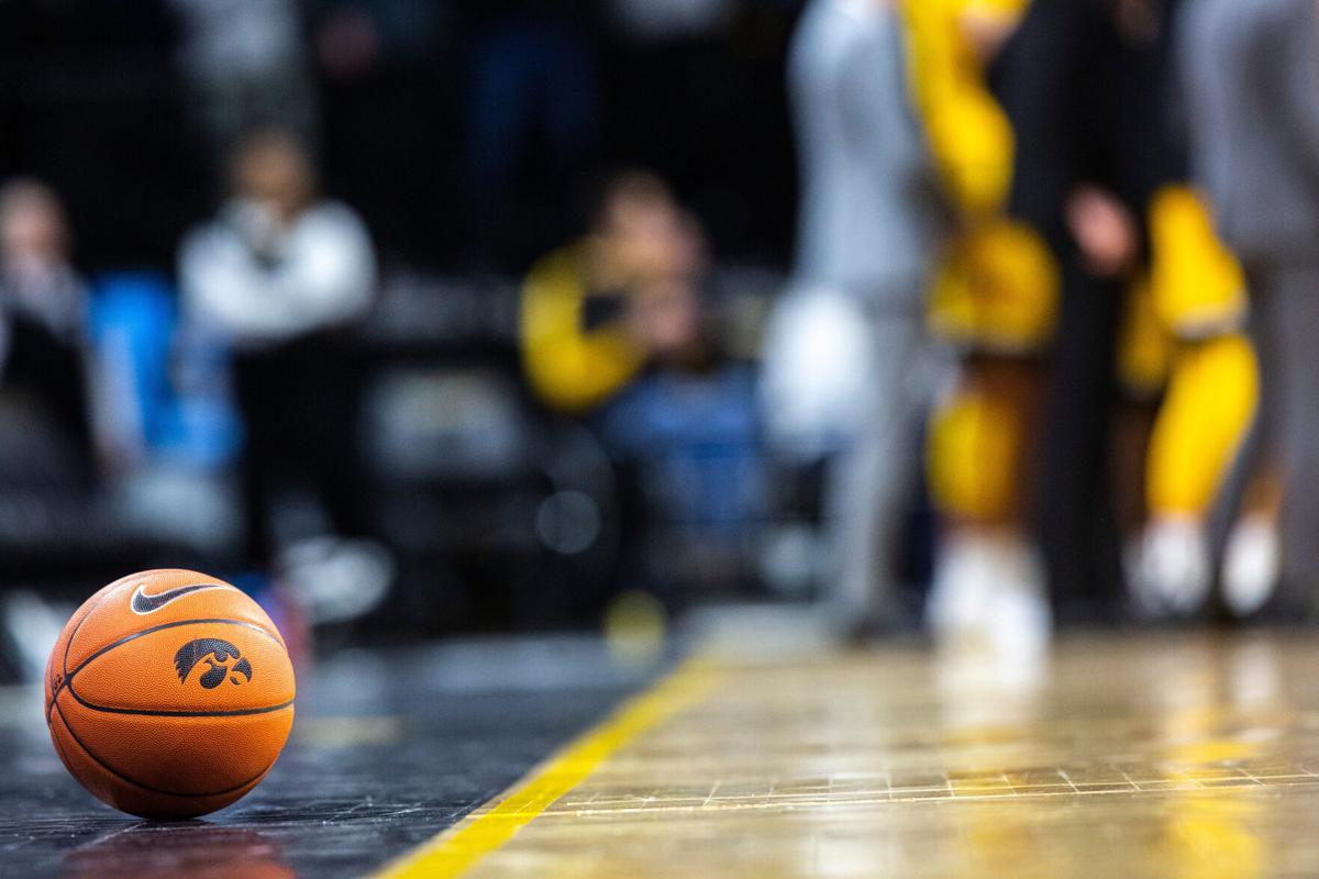 An Iowa basketball with a Tigerhawk logo rests along the baseline ...