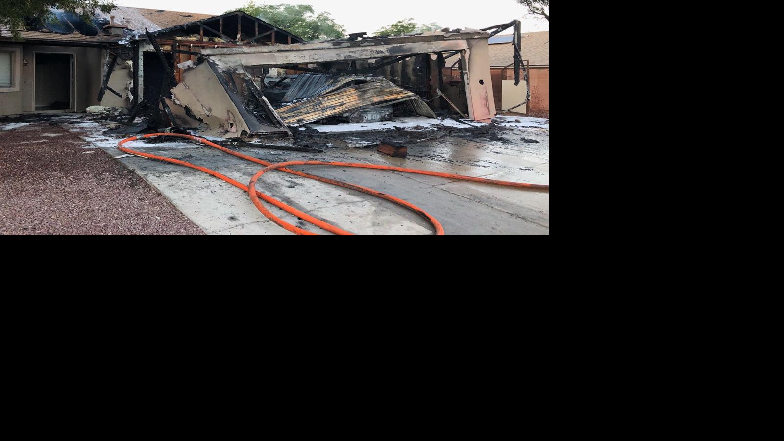 Burning garage collapses on vehicle, but 3 residents, 6 dogs escape home