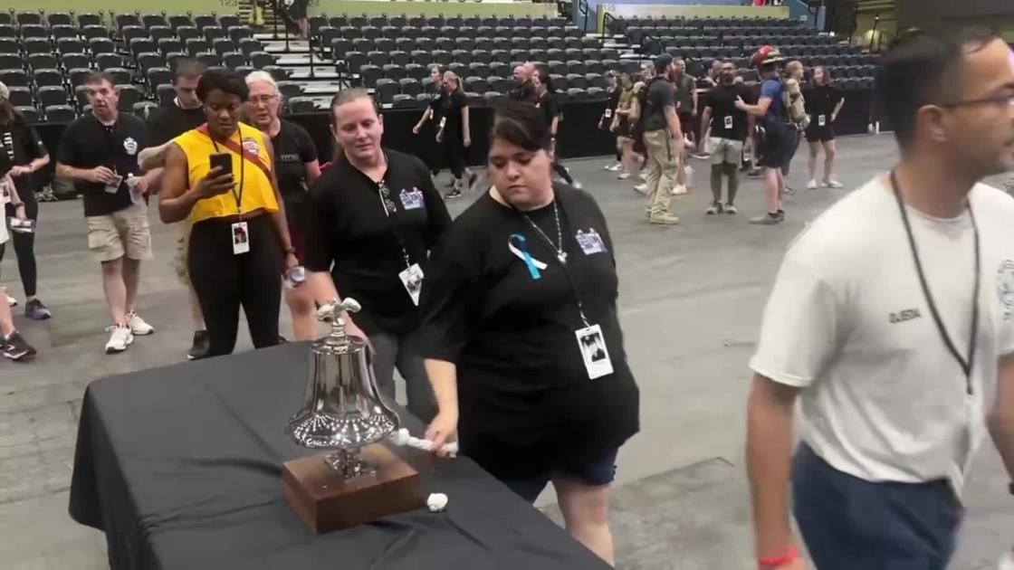 Participants ring the bell after competing the 9/11 Tucson Arena Tower ...