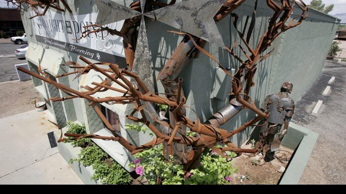 Tucson Oddity: Gnarled metal 'tree' takes firm root at piercing studio