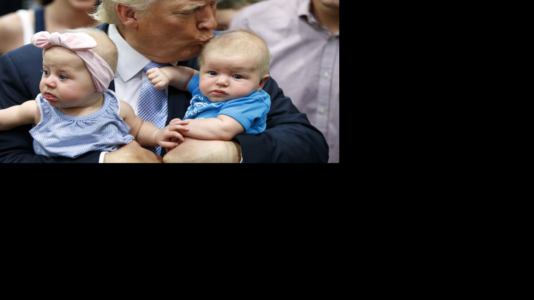 17 photos of politicians kissing babies — and why they do it