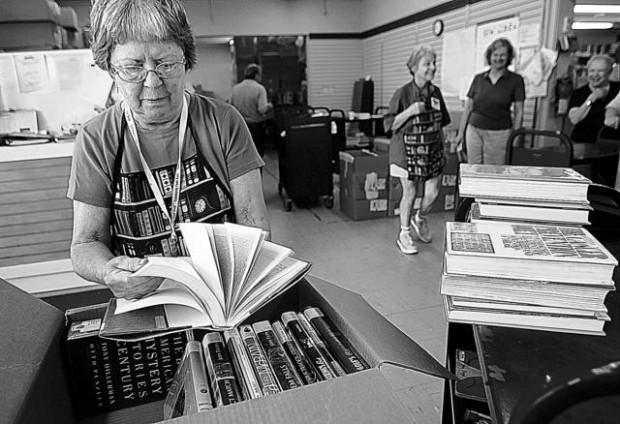 Friends helping library out with sale