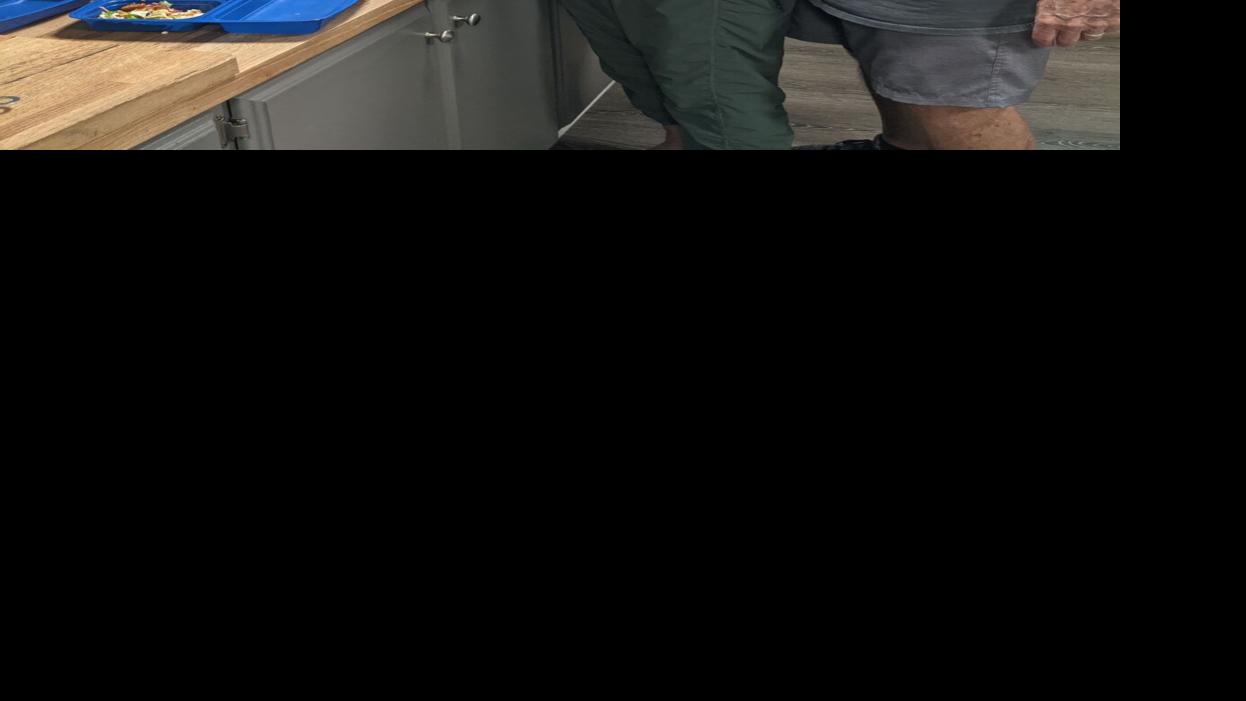 Preparing meals for neighbors gets couple belled