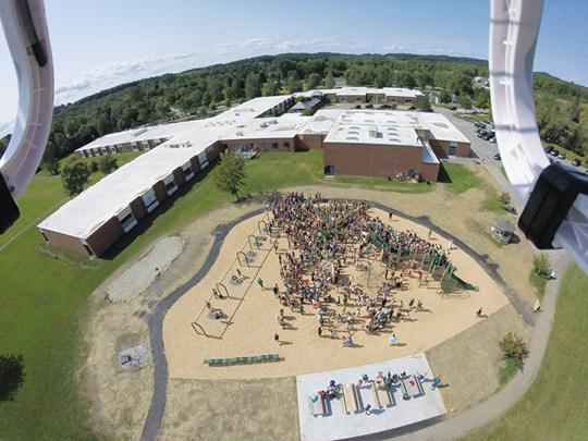Drone hovers above Shelburne Community School playground to capture ...