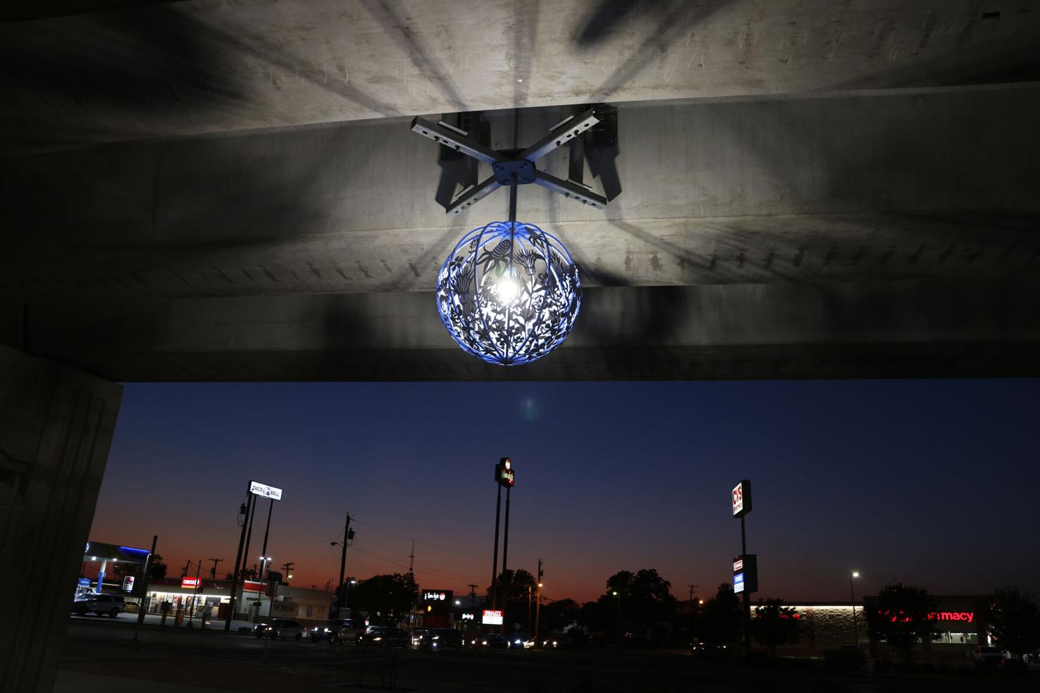 Waco-themed globe lights back at I-35 underpass, in blue