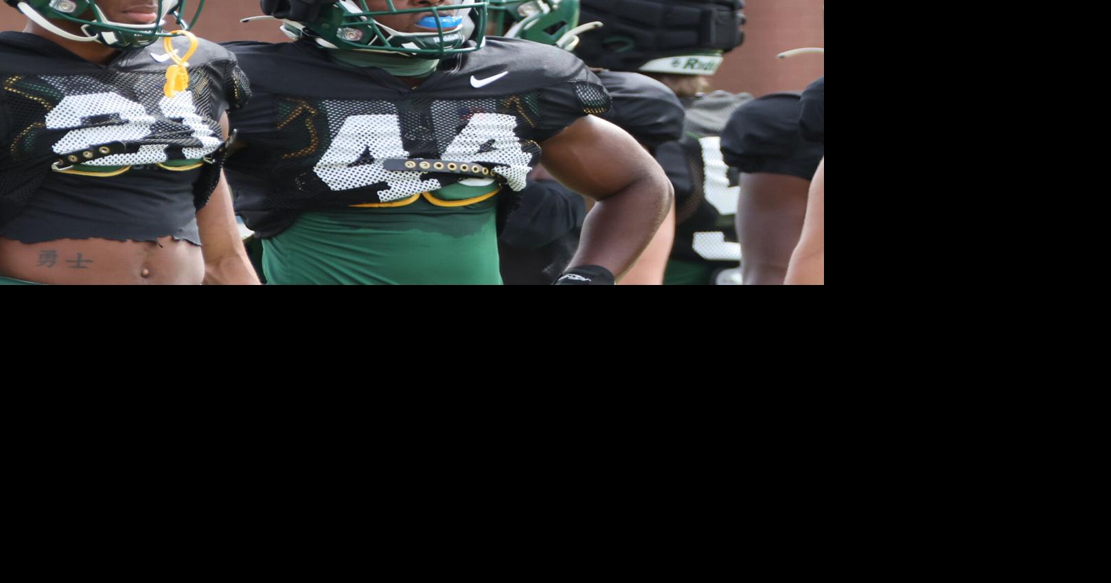 Baylor linebackers carrying Bernard's torch