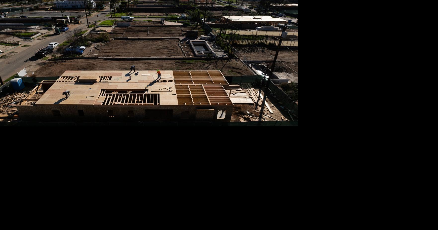 Fewer than a dozen homes have been rebuilt a year after being burned ...