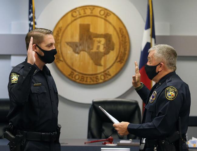 Robinson swears in new police chief