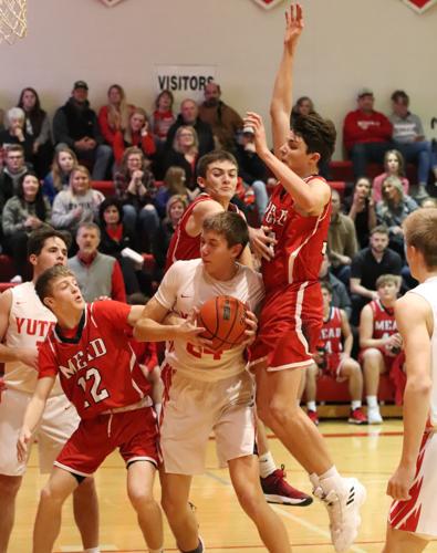 Yutan fights off upset bid, downs Raiders 49-42