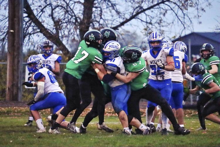 Cowboys drag Wolves through the mud in 36-0 win, clinching No. 2 seed ...
