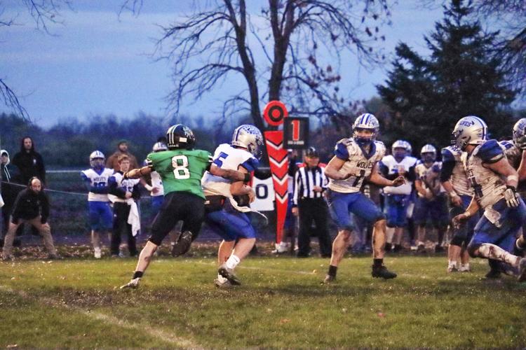 Cowboys drag Wolves through the mud in 36-0 win, clinching No. 2 seed ...