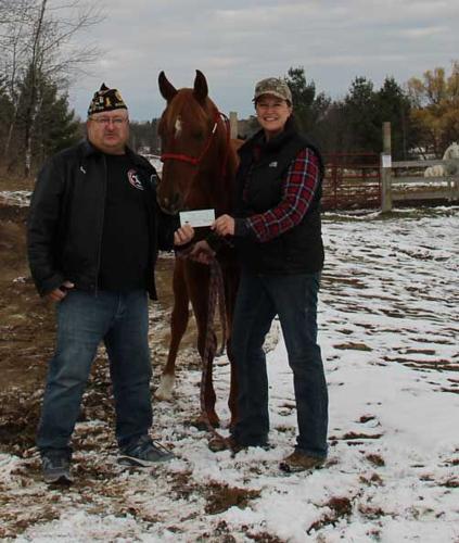 Walker Legion Gambling Committee member Tony Sauer presents Teri ...