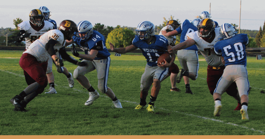 WHA offensive linemen Tom Hansen (64) and Caden Opheim (58) each make a ...
