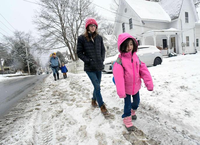 Winter storms bring snow, ice and school and road closures to New ...