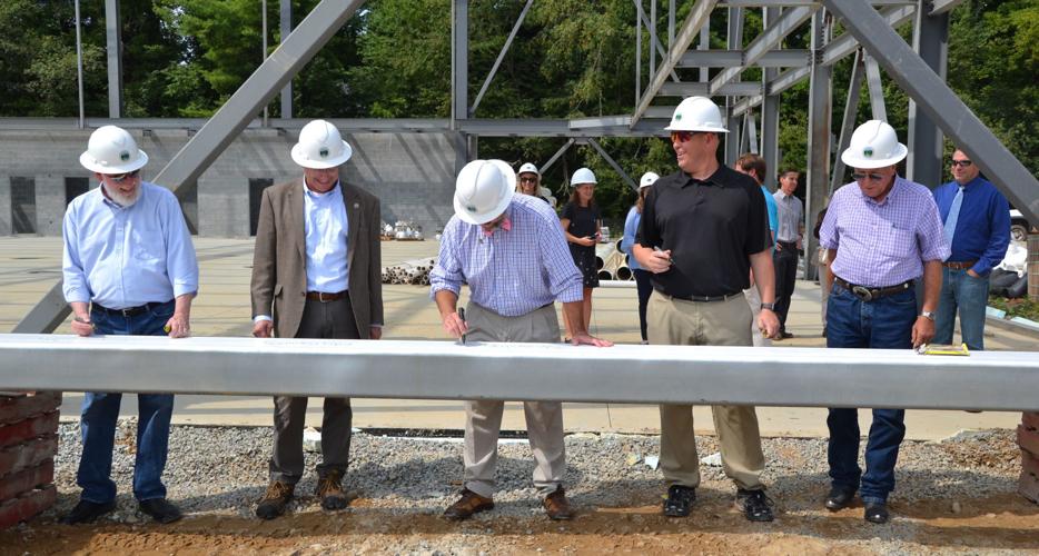 Officials place last steel beam in rec center framework | News ...