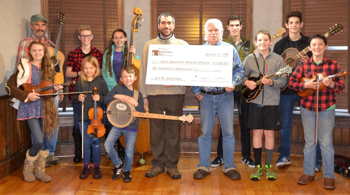 Mountain Home Music awards check to Junior Appalachian Musicians ...