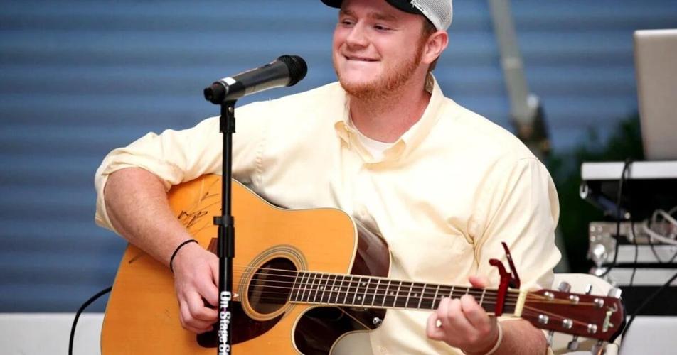 Adam Church performing at Firerock Station in benefit concert ...
