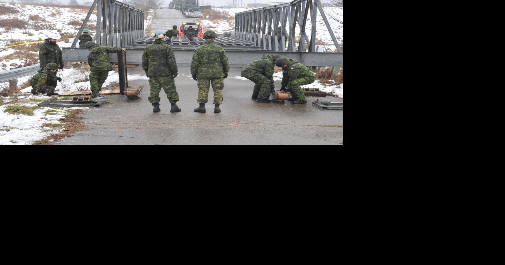 Local army engineers building bridges in community with city partners