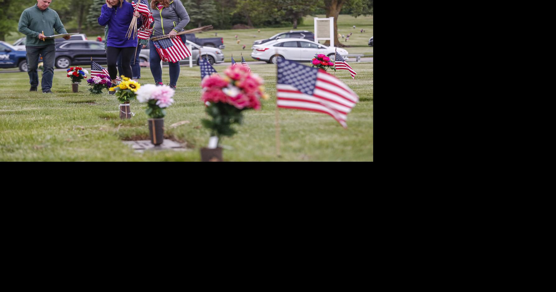 Tradition of placing flags on veterans' graves for Memorial Day ...