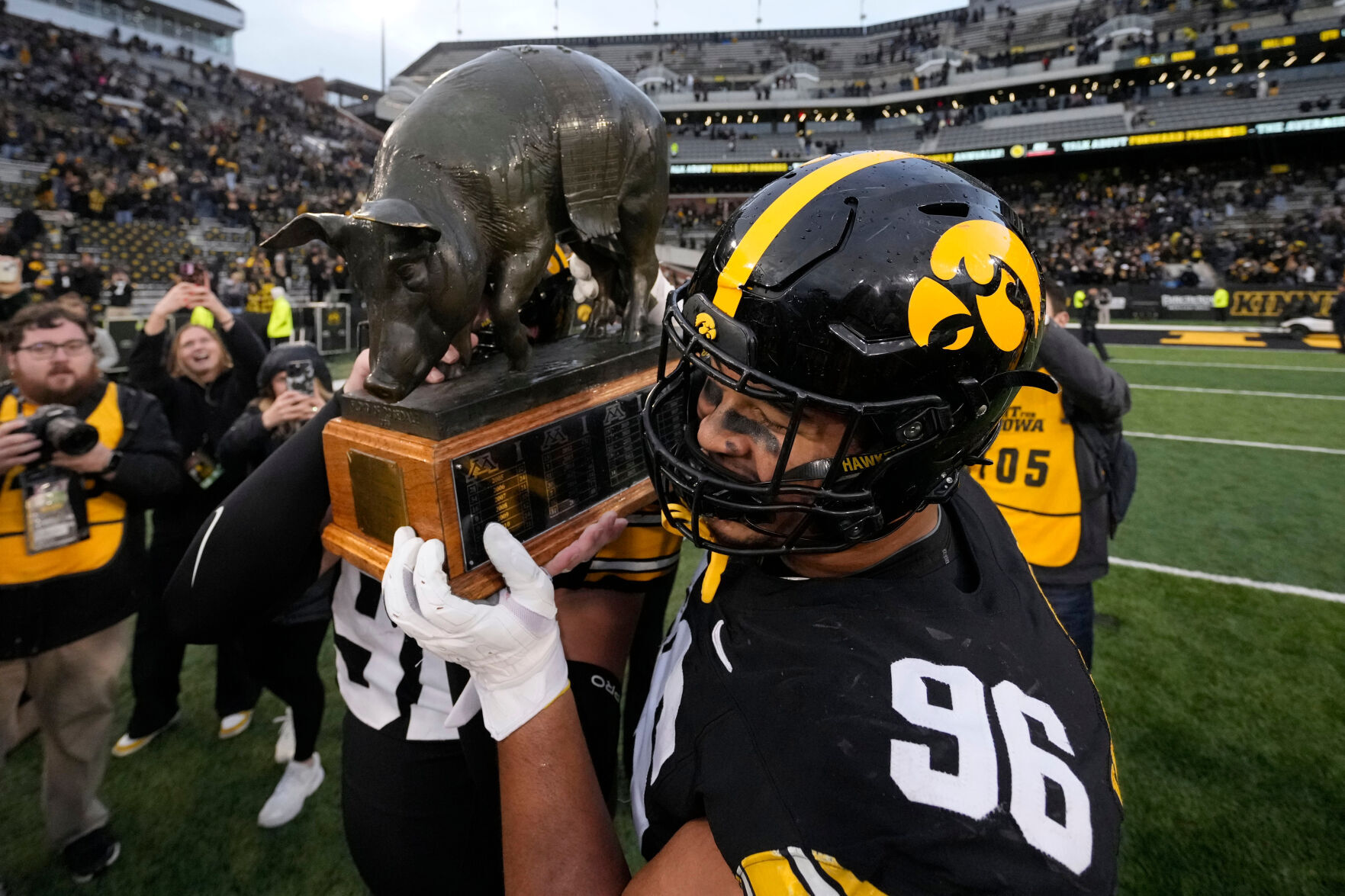 Meet the rivalry trophies of college football